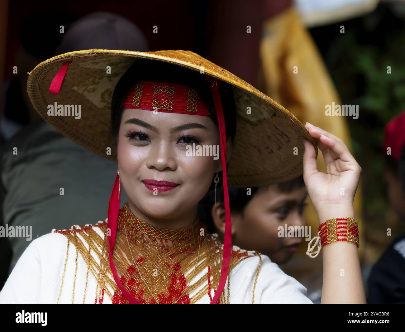 Toraja woman in traditional colourful clothing with rice straw hat, portrait, Tana Toraja ...