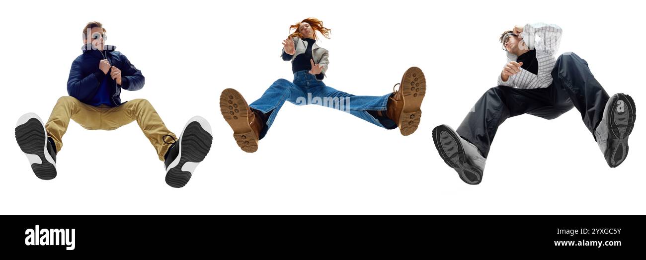 Three trendy young people in stylish casual clothes posing in dynamic ...