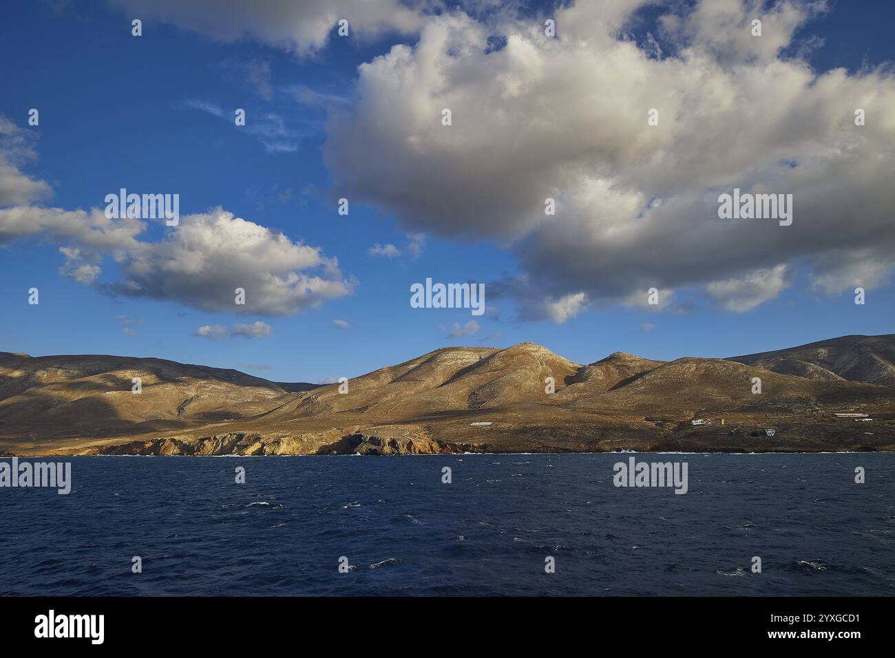 Open seascape with light cloud cover and view of an island, Kassos ...