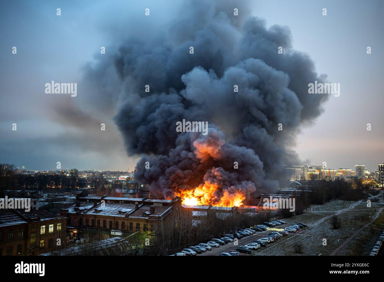 Heavy fire with acrid smoke in warehouse with toxic paint materials ...