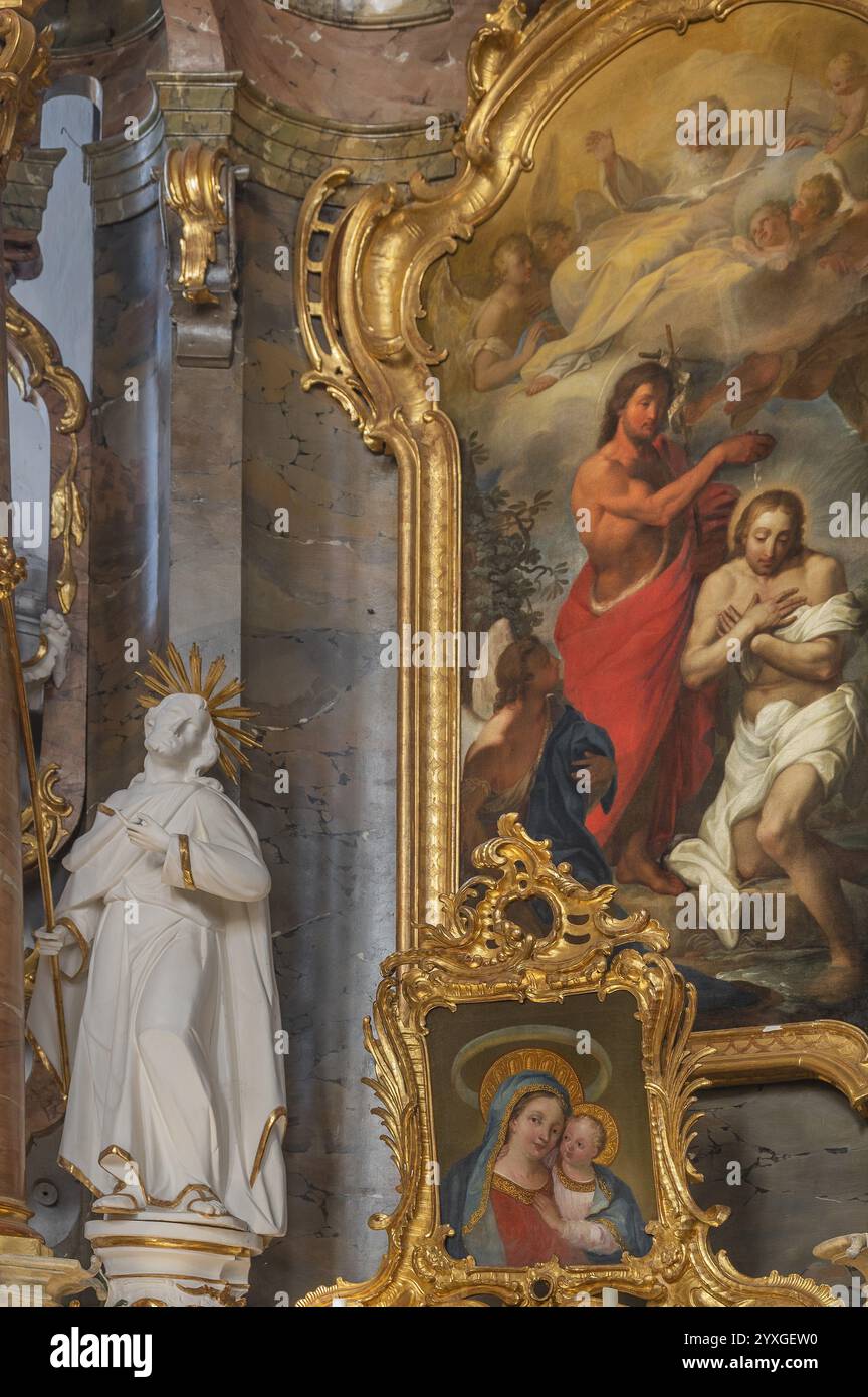 Side altar with portrait of the Baptism of Christ in the rococo church ...
