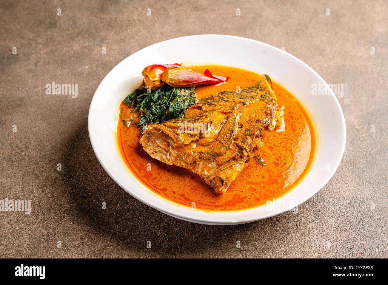 snapper curry fish head from padang, west sumatera, indonesia Stock ...