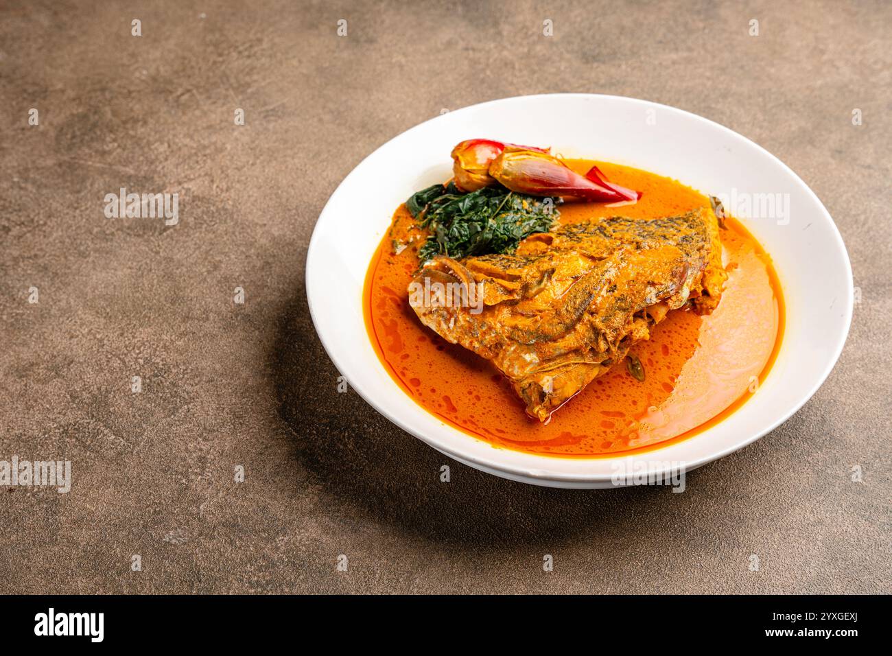 snapper curry fish head from padang, west sumatera, indonesia Stock ...