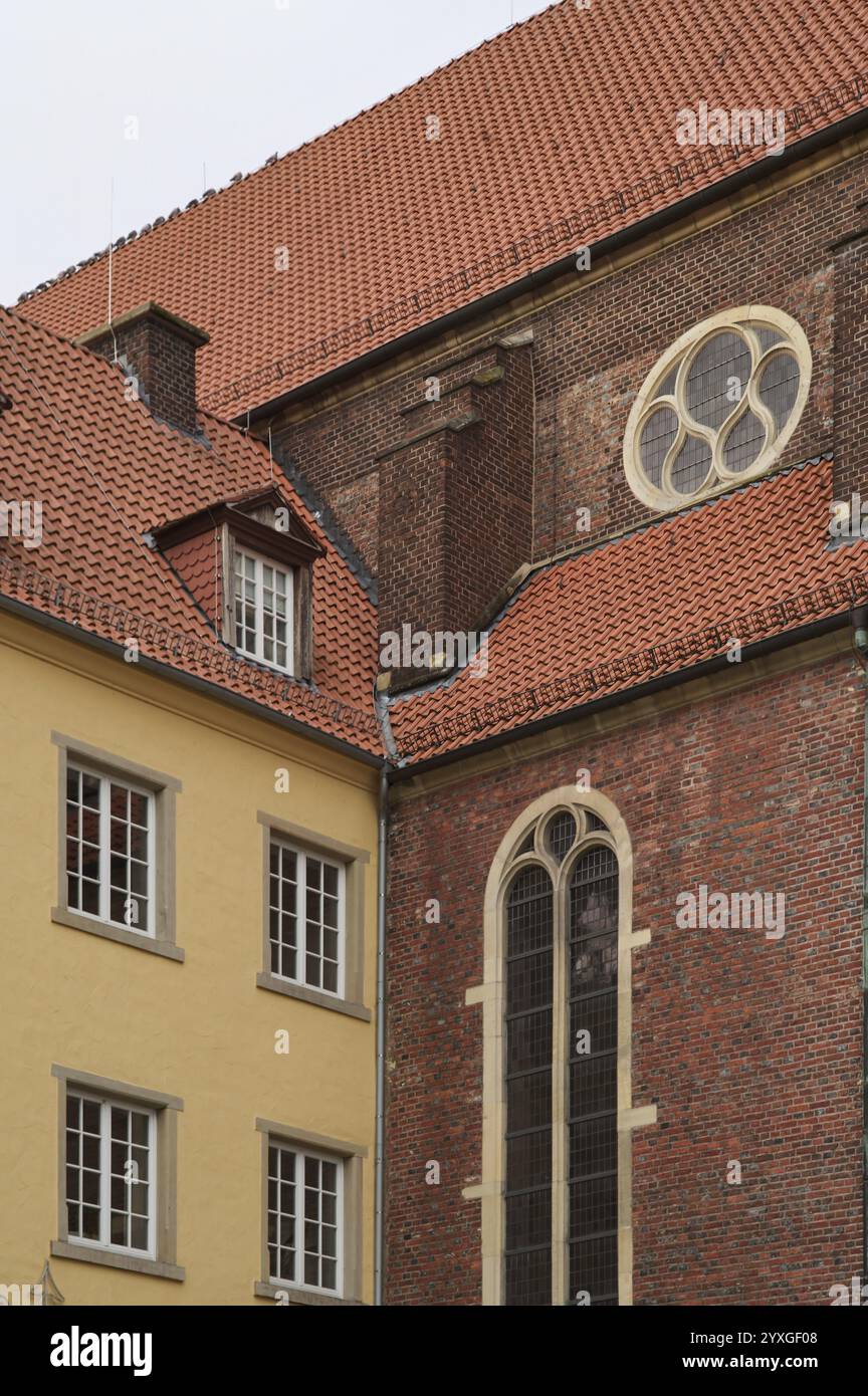Traditional architecture showcasing a church and a residential building ...
