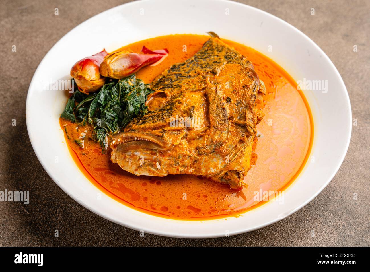 snapper curry fish head from padang, west sumatera, indonesia Stock ...