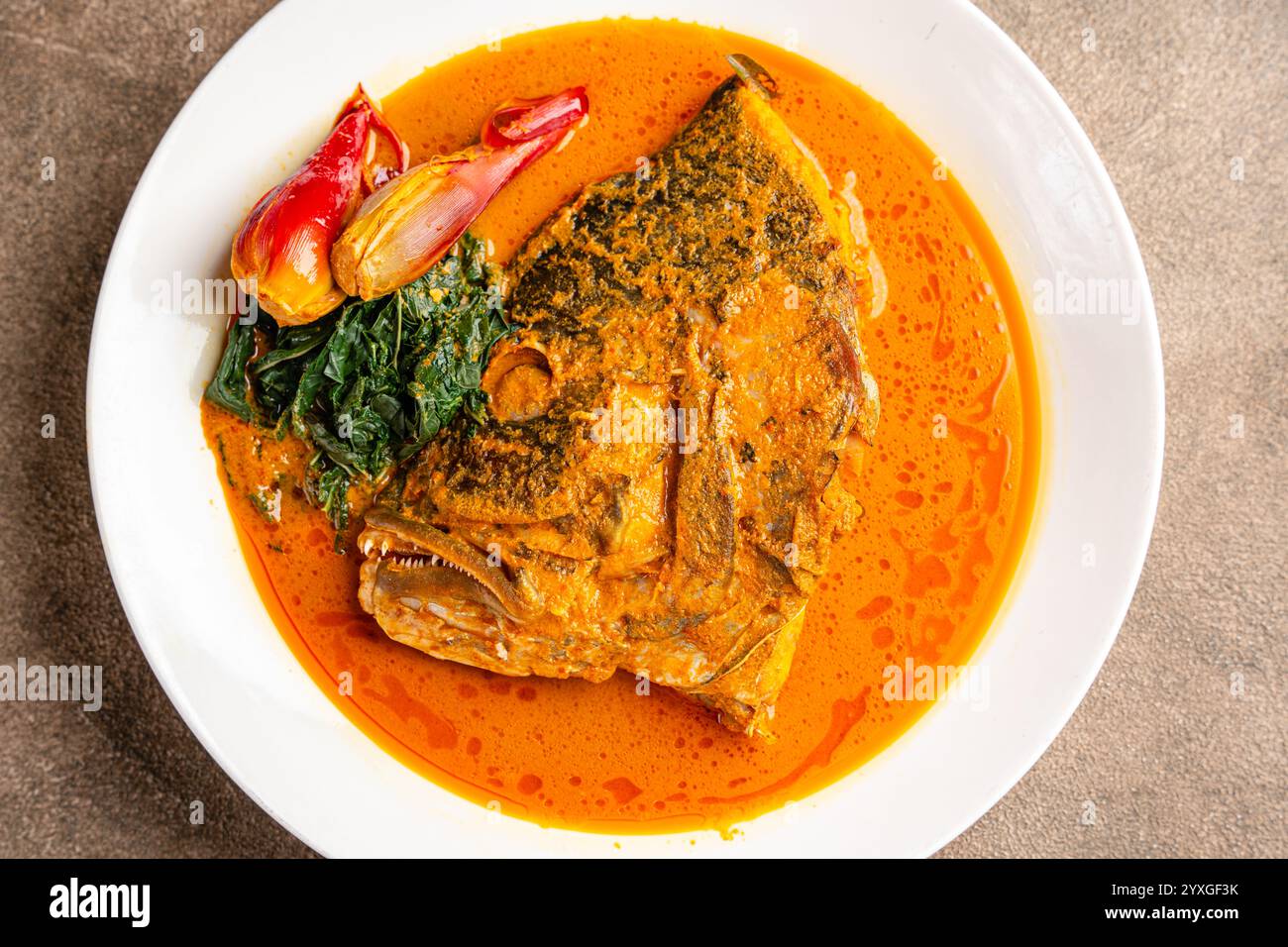 snapper curry fish head from padang, west sumatera, indonesia Stock ...