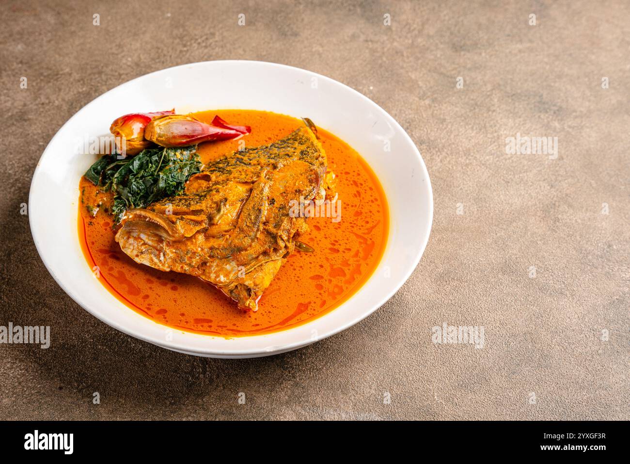 snapper curry fish head from padang, west sumatera, indonesia Stock ...