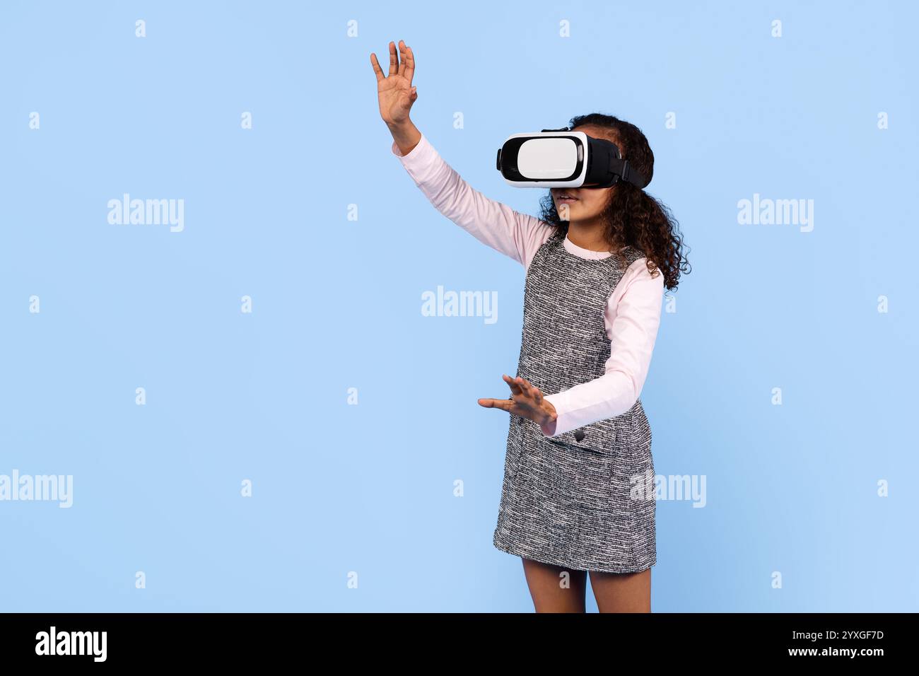 Happy girl exploring virtual reality while having fun in a playful ...