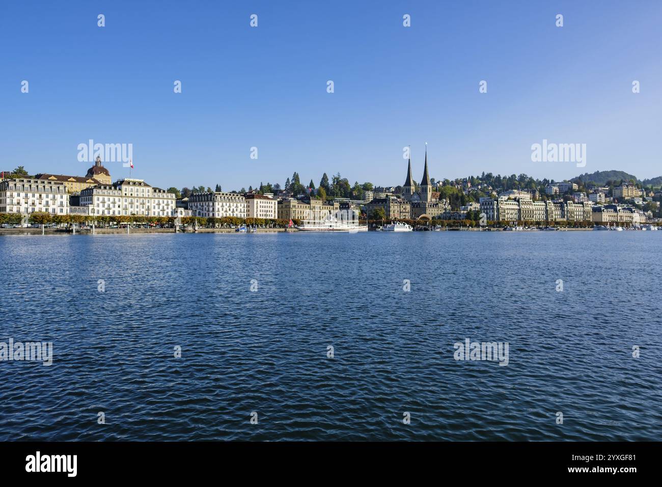 Panorama of Lucerne with church towers and clear architecture under a ...
