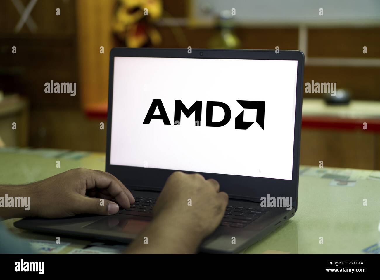 AMD logo displayed on smartphone screen. Advanced Micro Devices, Inc ...