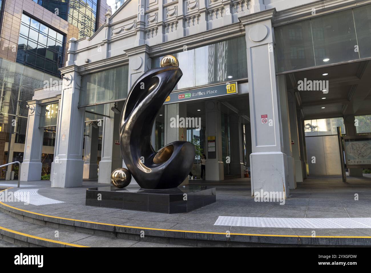 Raffles Place Station, entrance to the metro, with sculpture Symphony ...