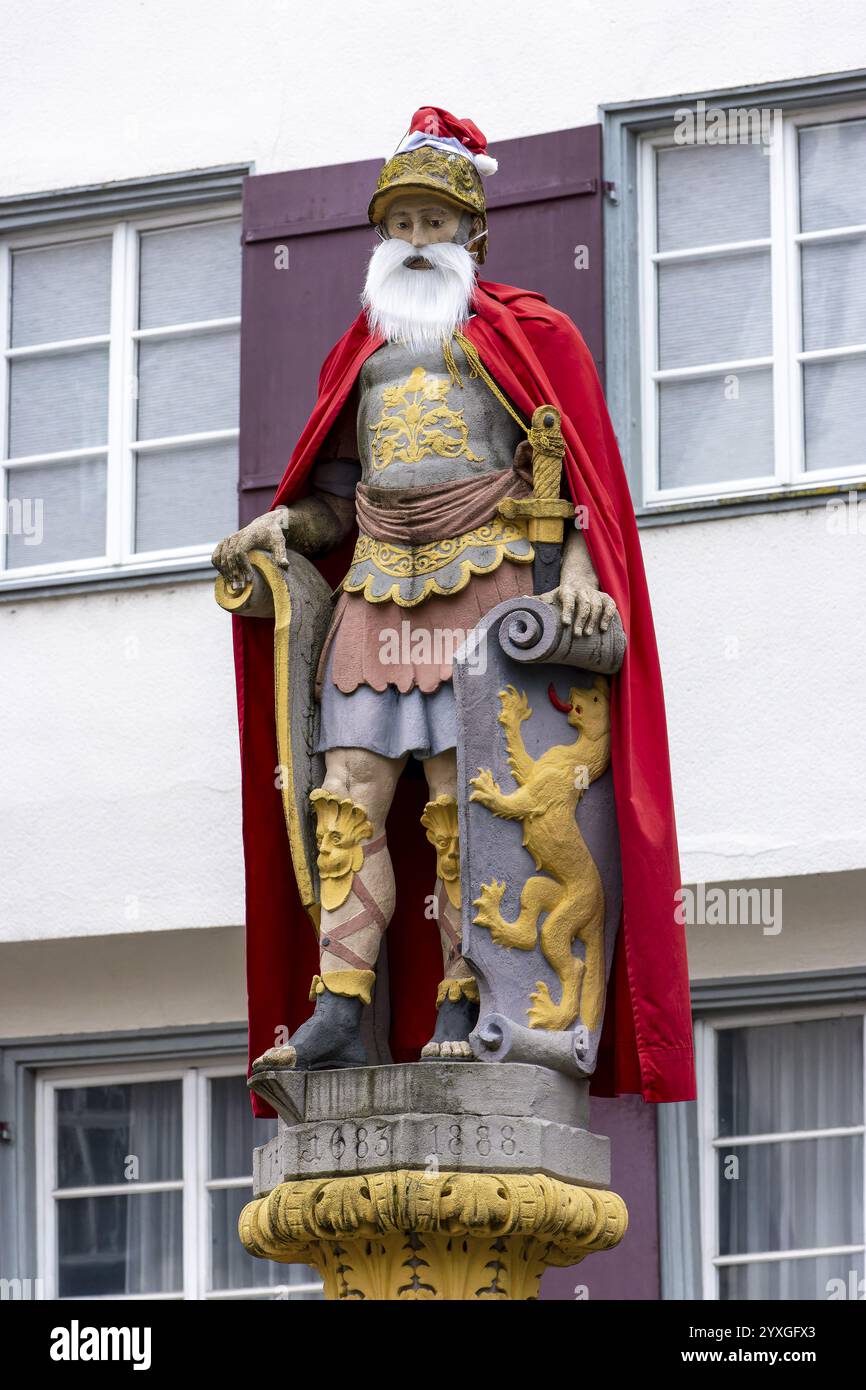 Knight figure of the market fountain, dressed in a red cloak and with a ...