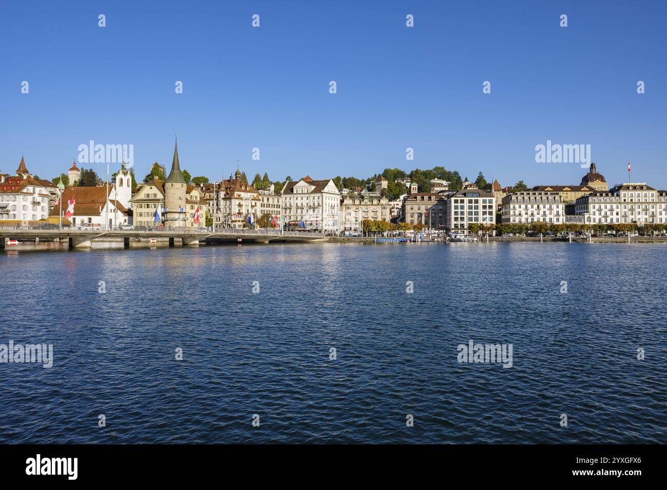 City view with bridge over the lake, church towers and historic ...