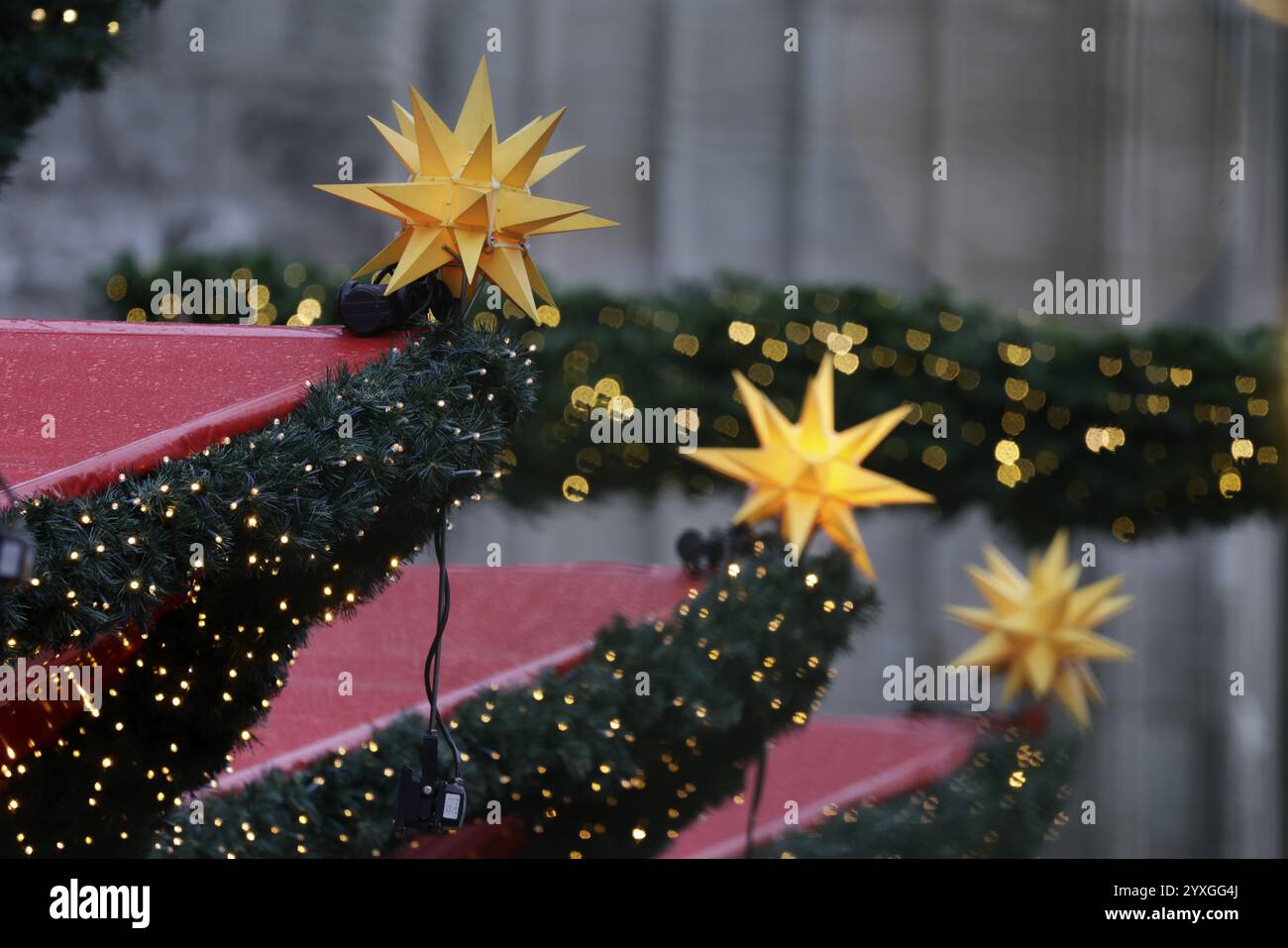 Shining stars, fir greenery and fairy lights in festive decorations at ...