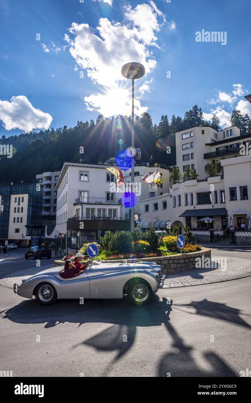 Luxury Classic Car in a Roundabout in City and with Blue Sky and Clouds ...