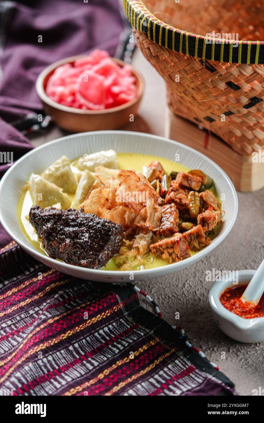 Lontong sayur or vegetable rice cake is an Indonesian traditional rice ...