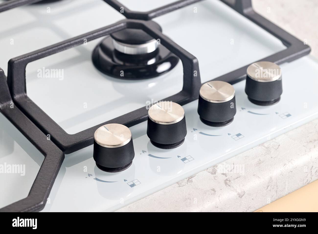 White hob cooker oven grill control knobs selective focus over out of ...