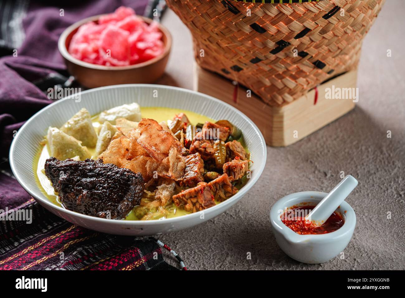 Lontong sayur or vegetable rice cake is an Indonesian traditional rice ...