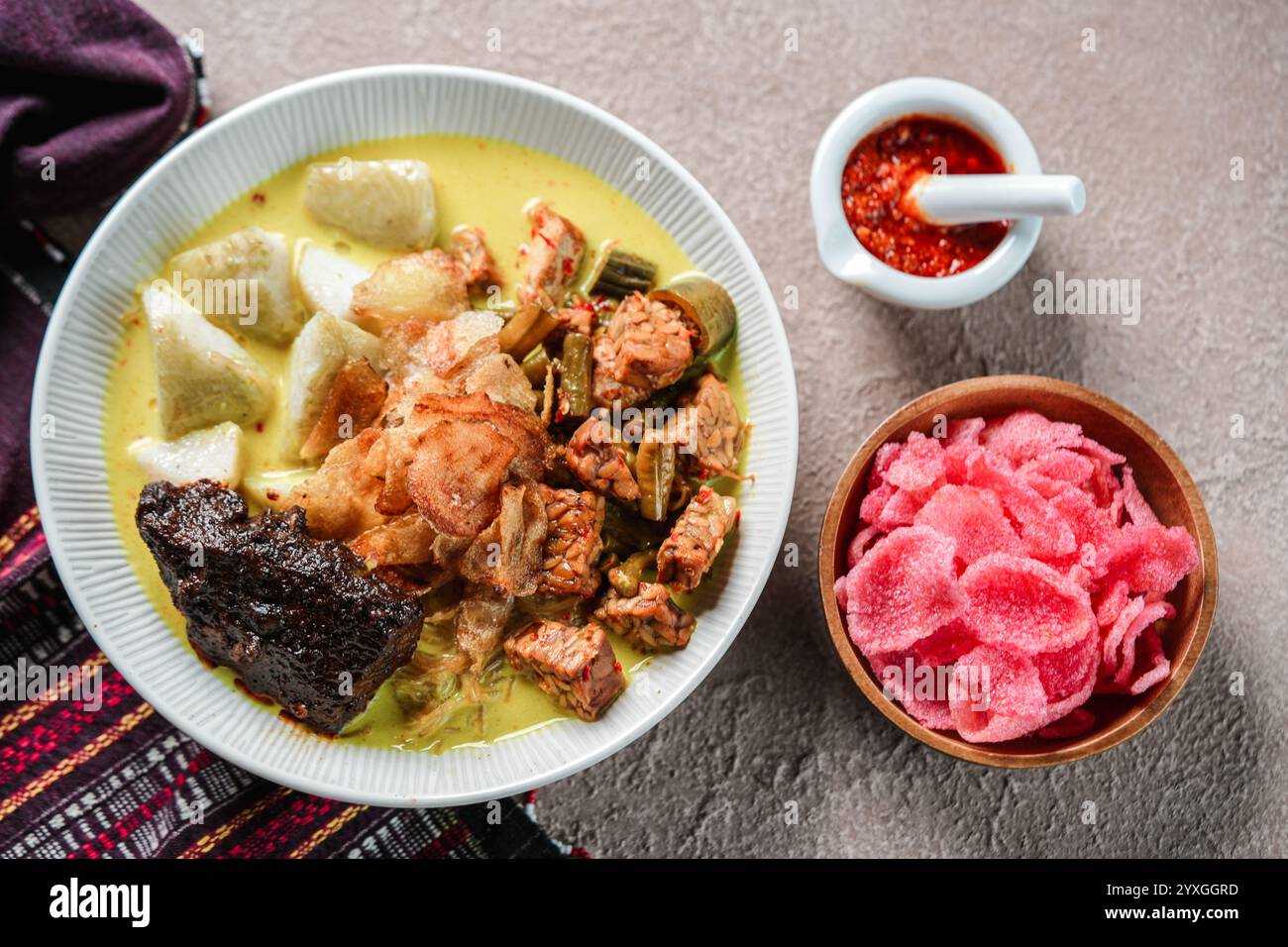 Lontong sayur or vegetable rice cake is an Indonesian traditional rice ...