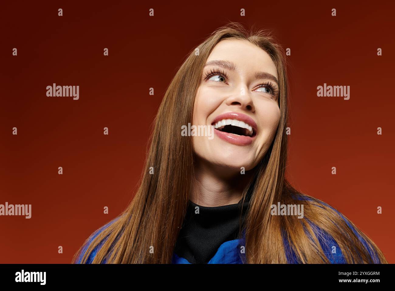 A vibrant woman with long hair beams with joy, showcasing her stylish ...