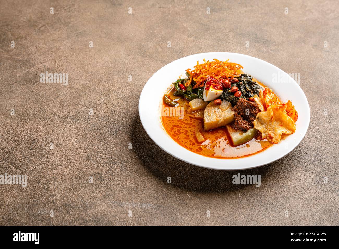 Lontong sayur or vegetable rice cake is an Indonesian traditional rice ...