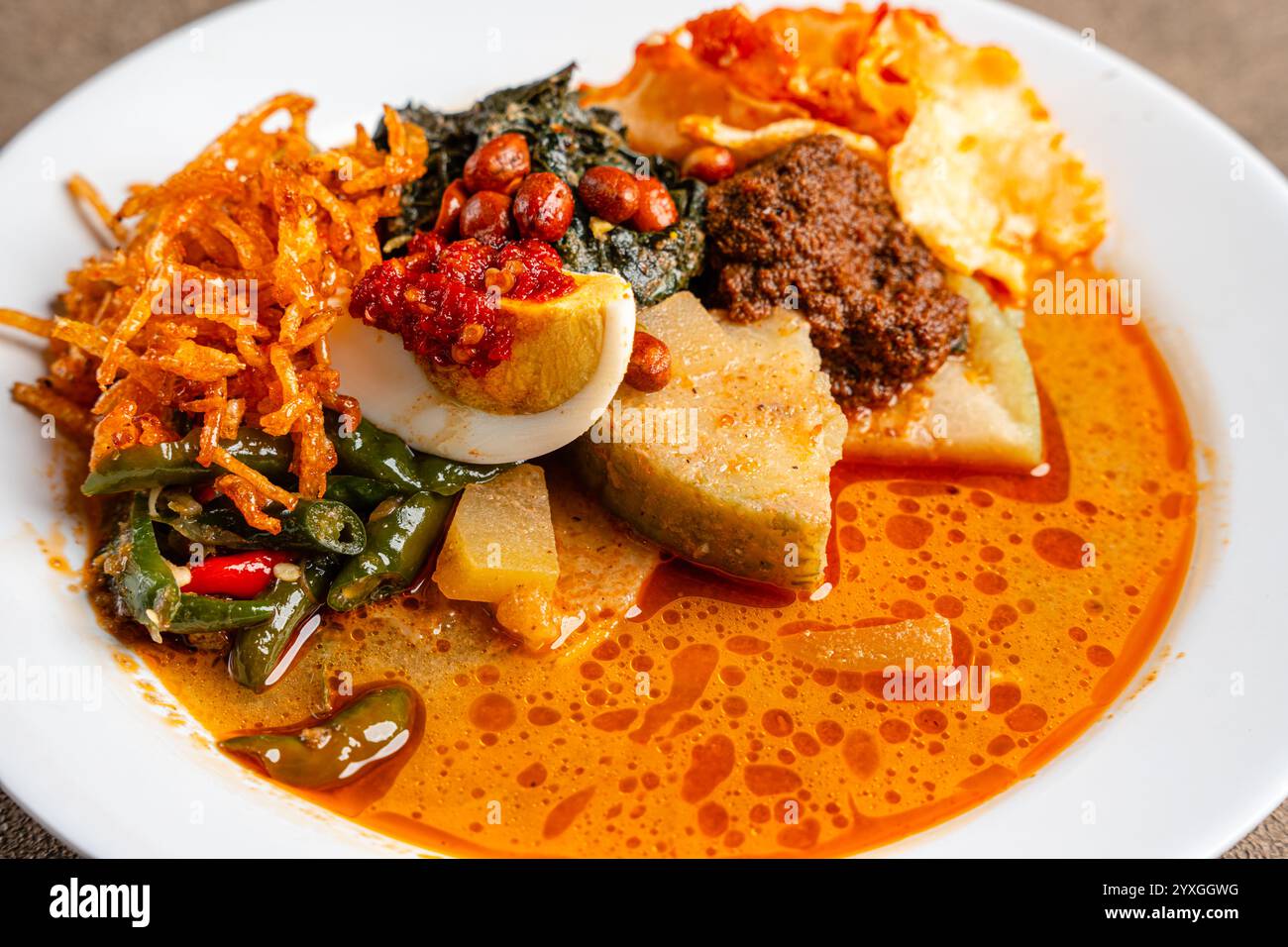 Lontong sayur or vegetable rice cake is an Indonesian traditional rice ...