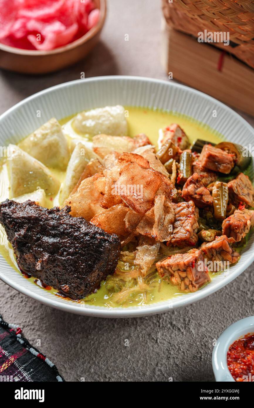 Lontong sayur or vegetable rice cake is an Indonesian traditional rice ...