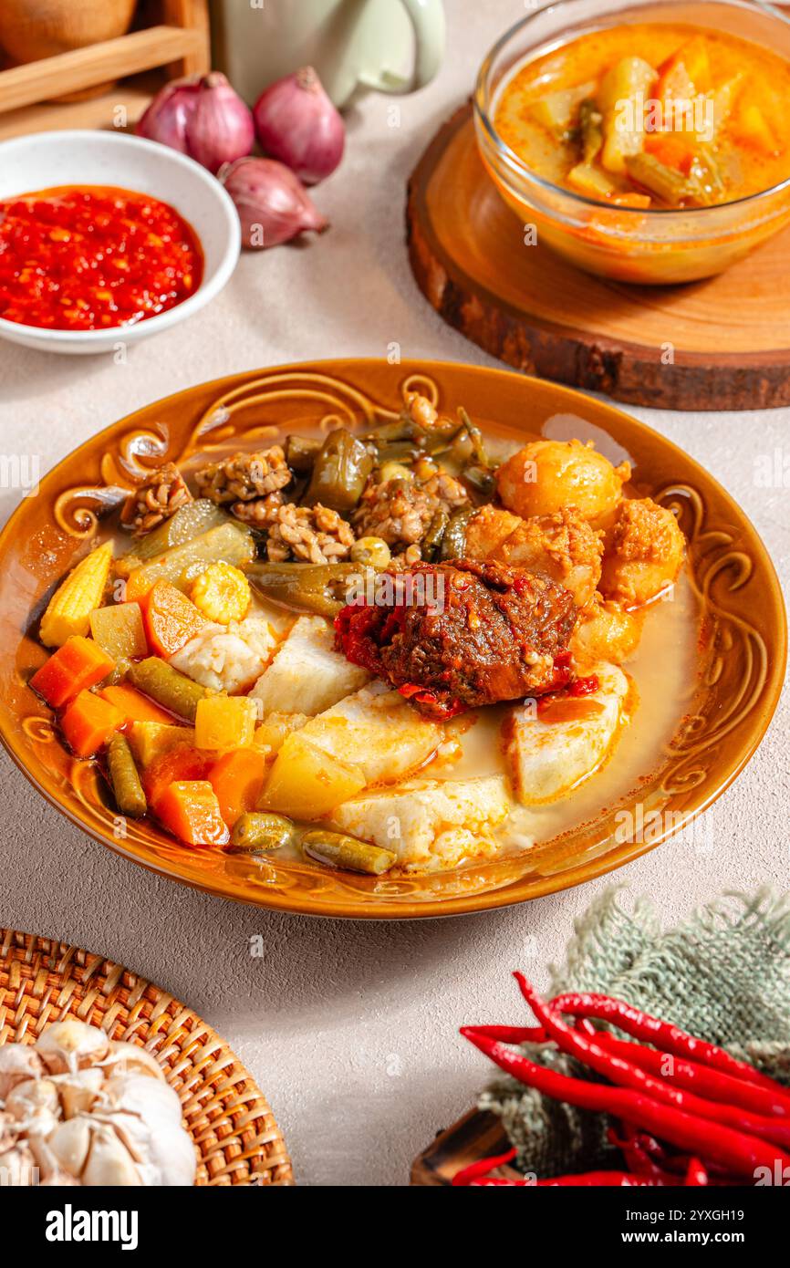 Lontong sayur or vegetable rice cake is an Indonesian traditional rice ...