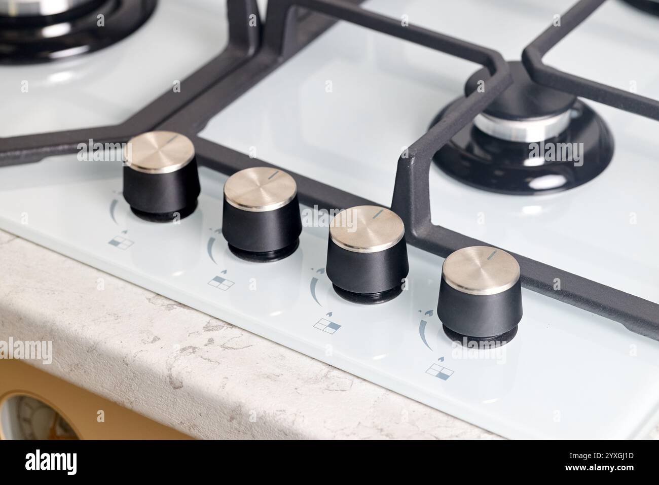 White hob cooker oven grill control knobs selective focus over out of ...