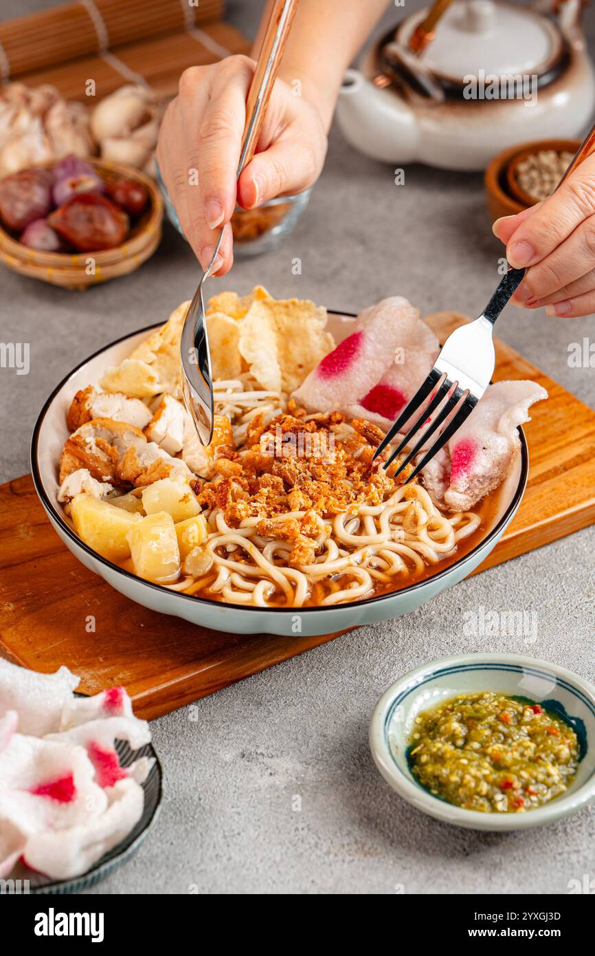 Emie, mie rebus is a noodle soup made from broth shrimp, topping boiled ...