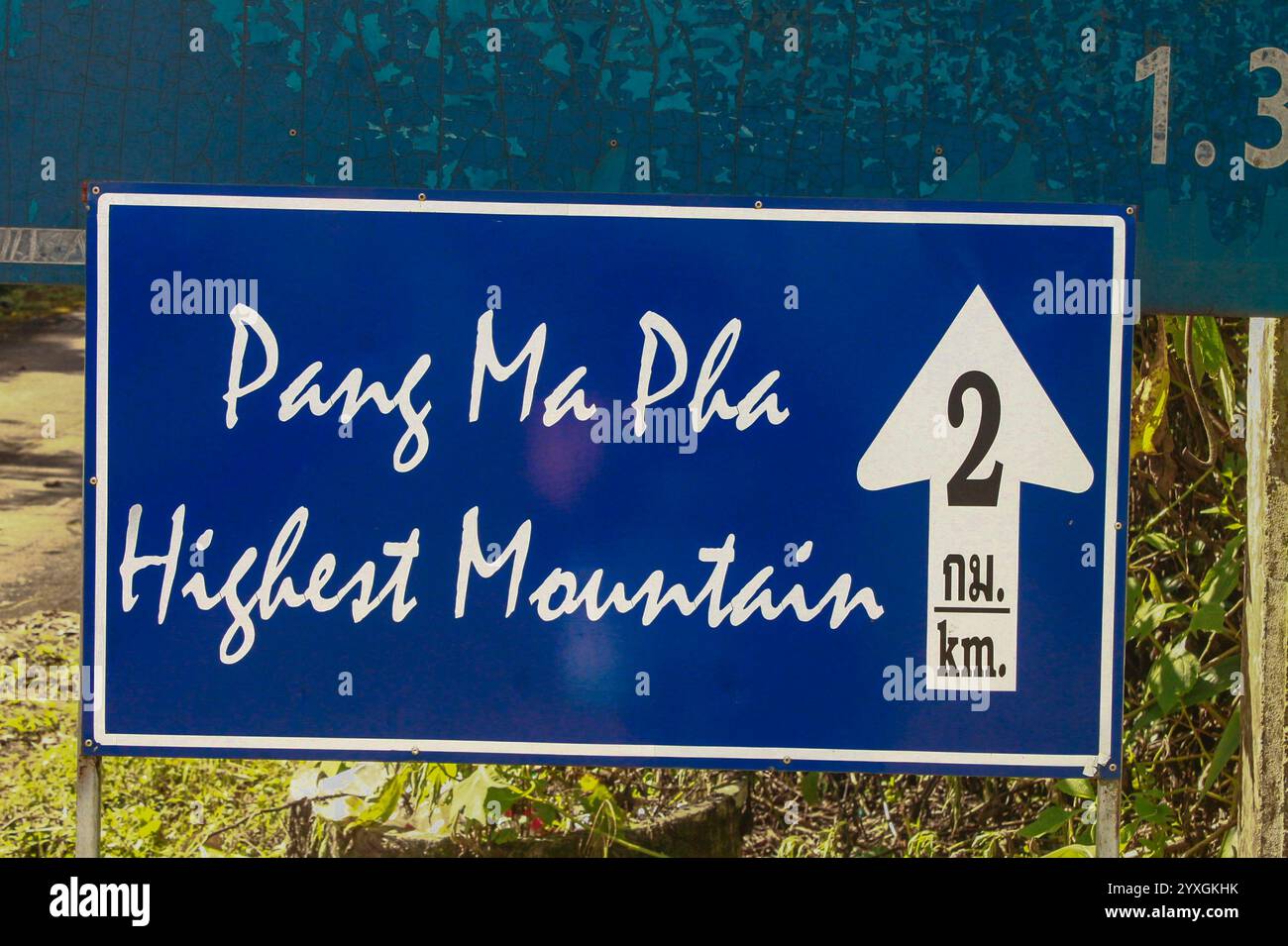 Blue directional road sign indicating "Pang Ma Pha Highest Mountain ...