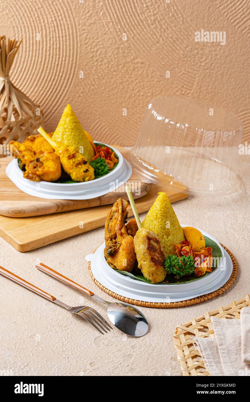 Tumpeng is an Indonesian cone-shaped rice dish with side dishes of ...