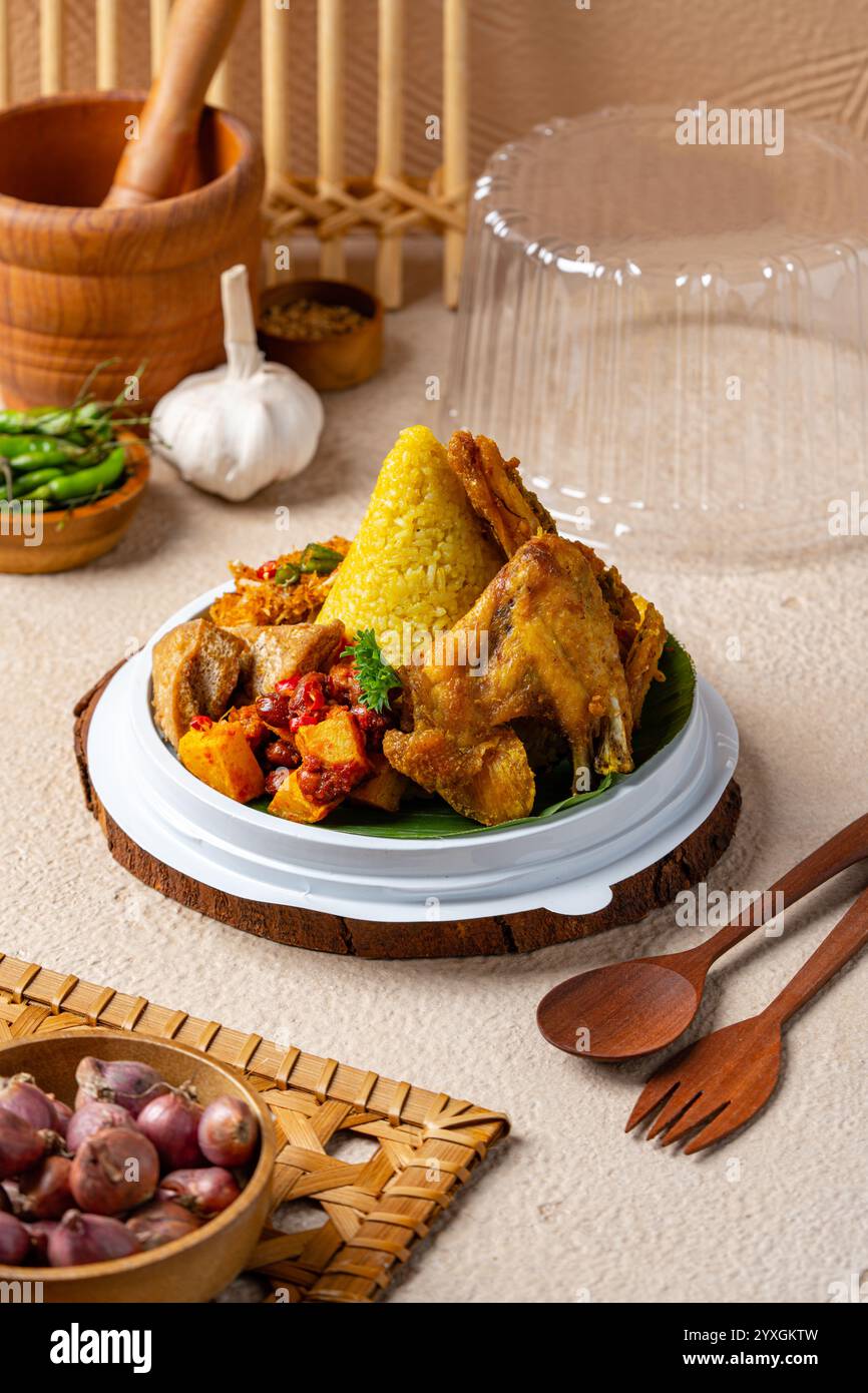 Tumpeng is an Indonesian cone-shaped rice dish with side dishes of ...