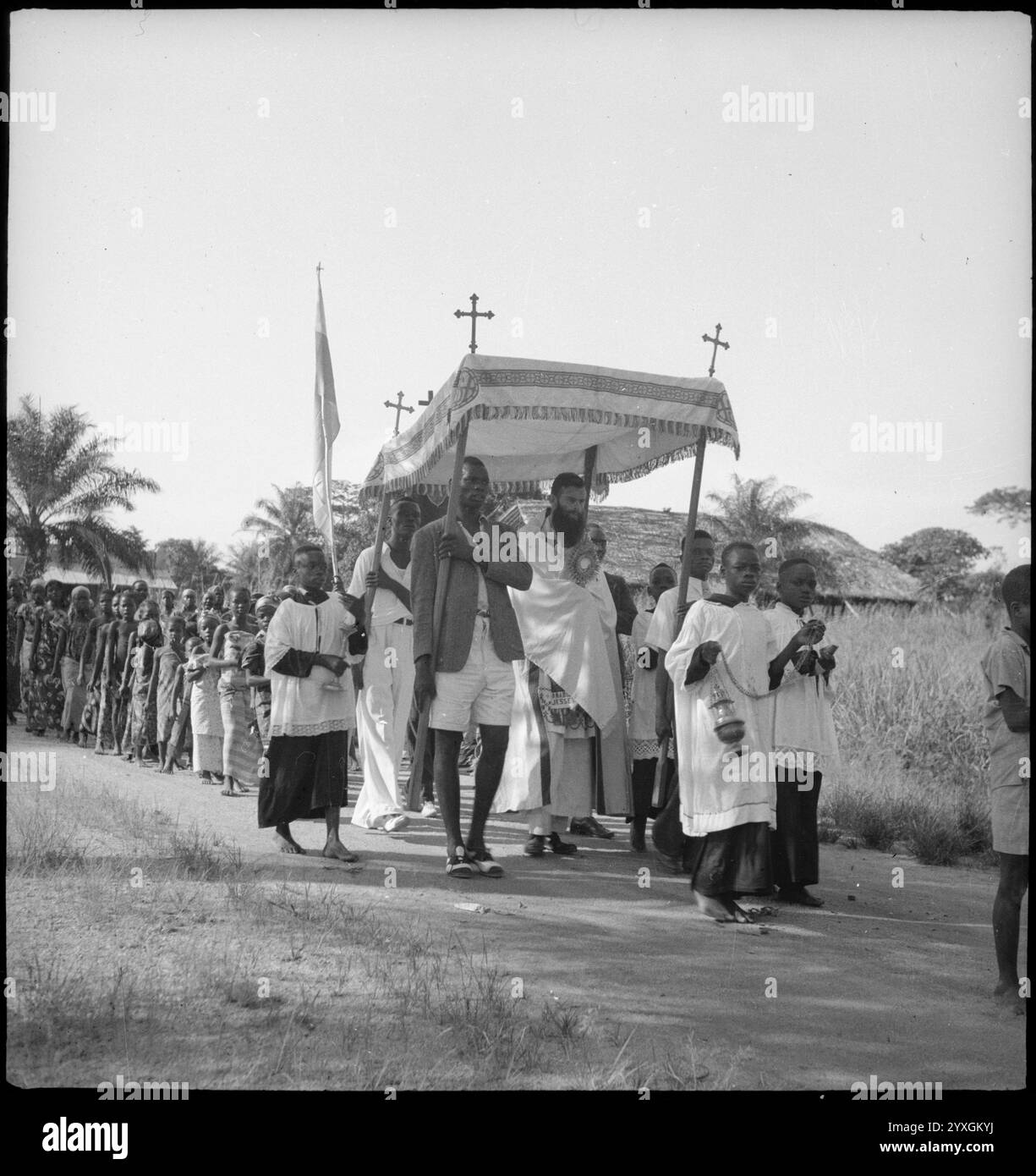 Belgian Congo, Buta. Religious Procession through a street with a ...