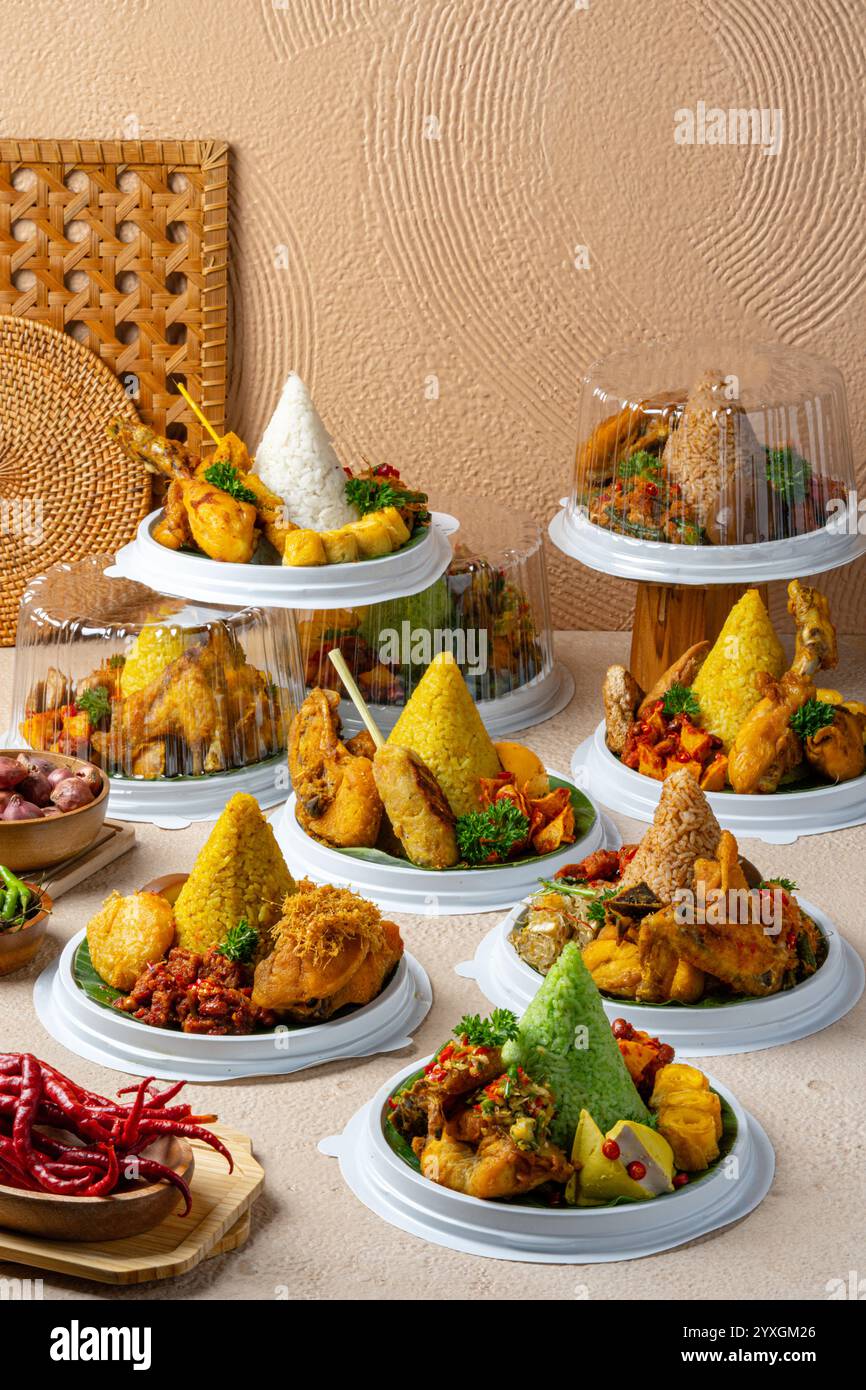 Tumpeng is an Indonesian cone-shaped rice dish with side dishes of ...