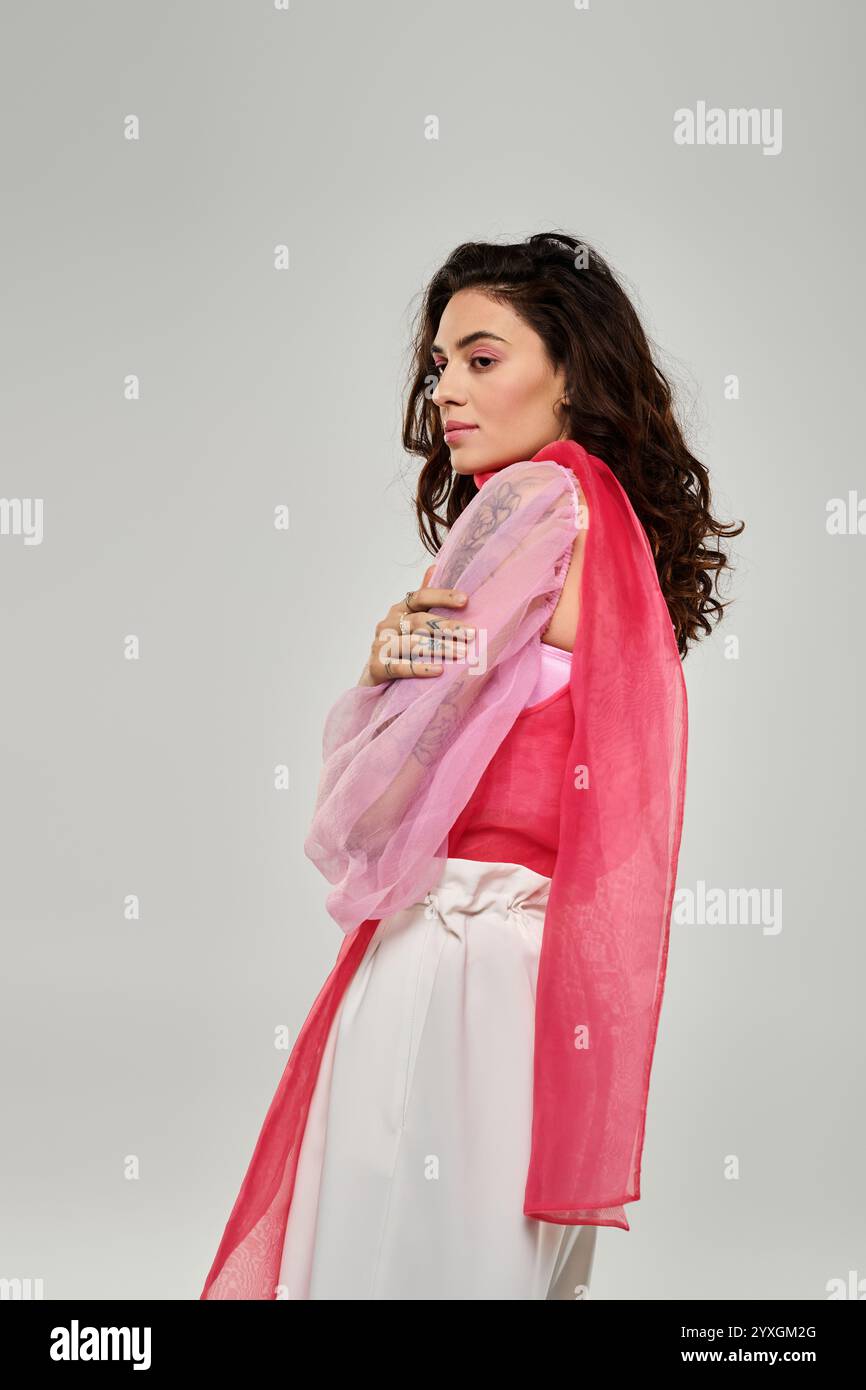 Beautiful young woman showcases her fashion sense with a vibrant scarf ...