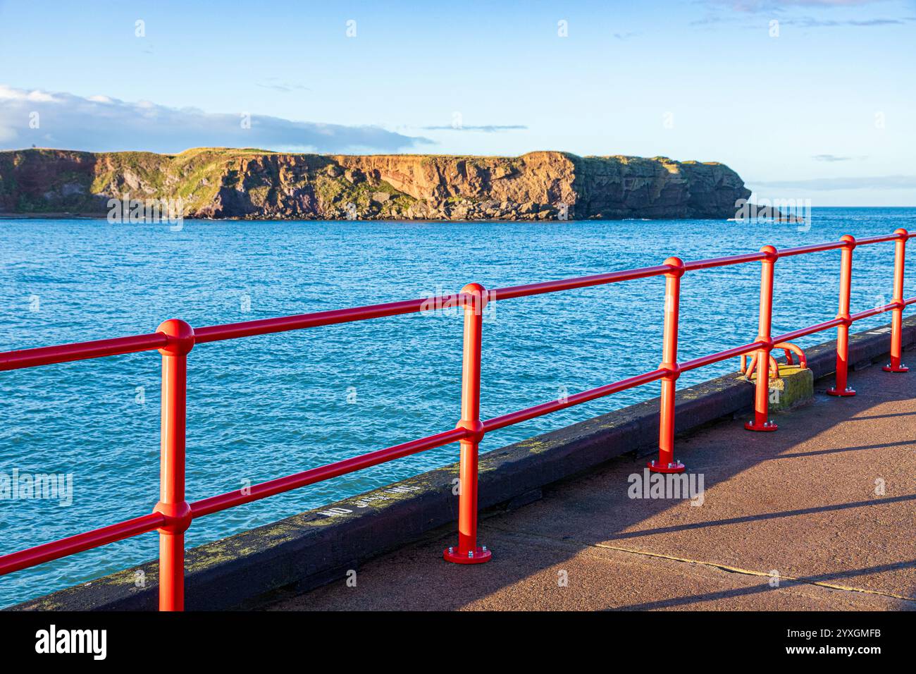 Shiny new red railings on West Pier in the harbour at Eyemouth ...