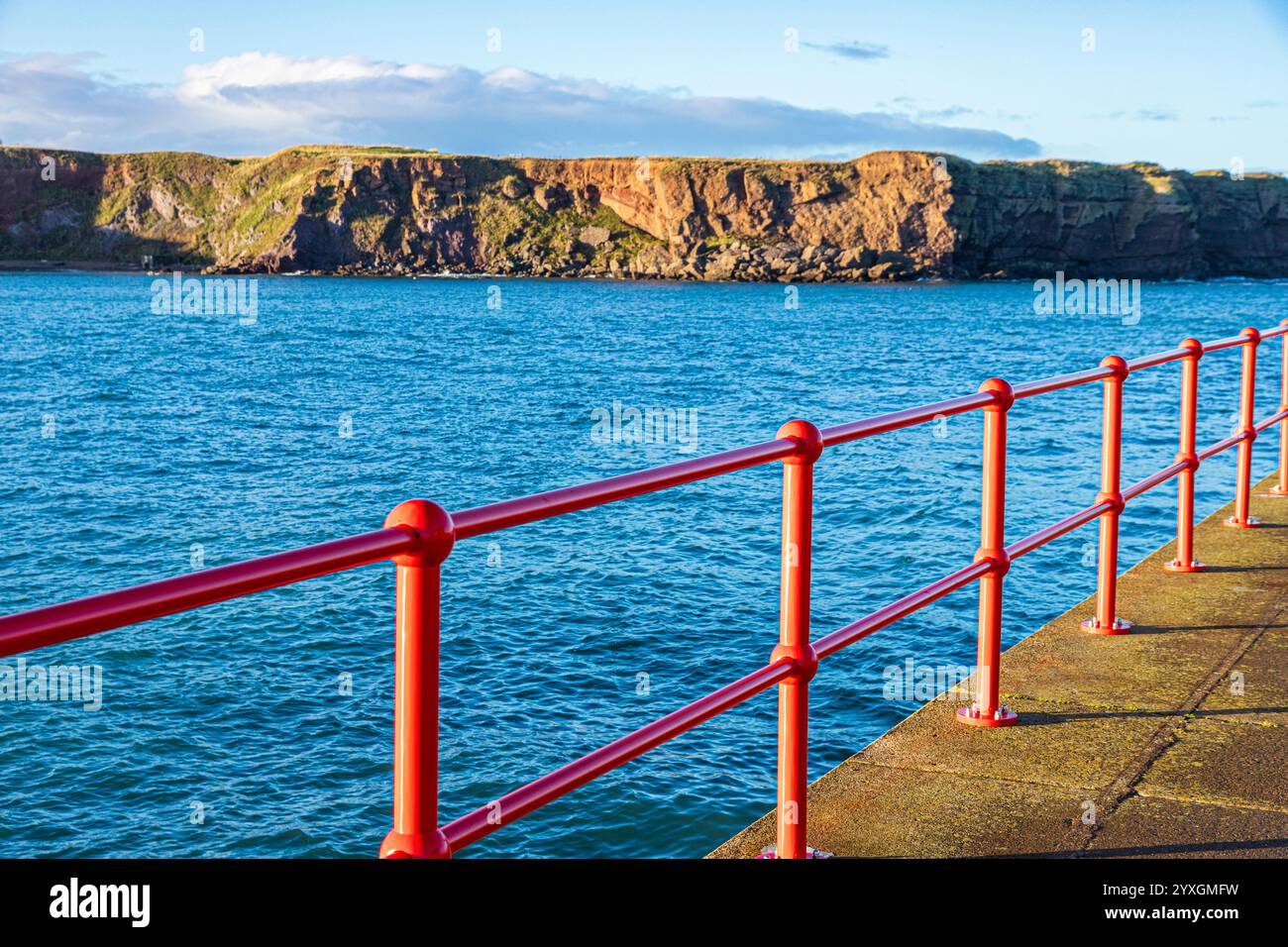 Shiny new red railings on West Pier in the harbour at Eyemouth ...