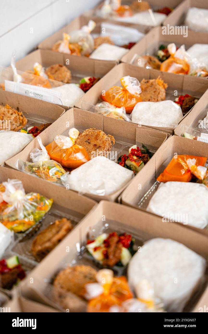 In Indonesian it is called Rice Box or Nasi kotak with perkedel kentang ...
