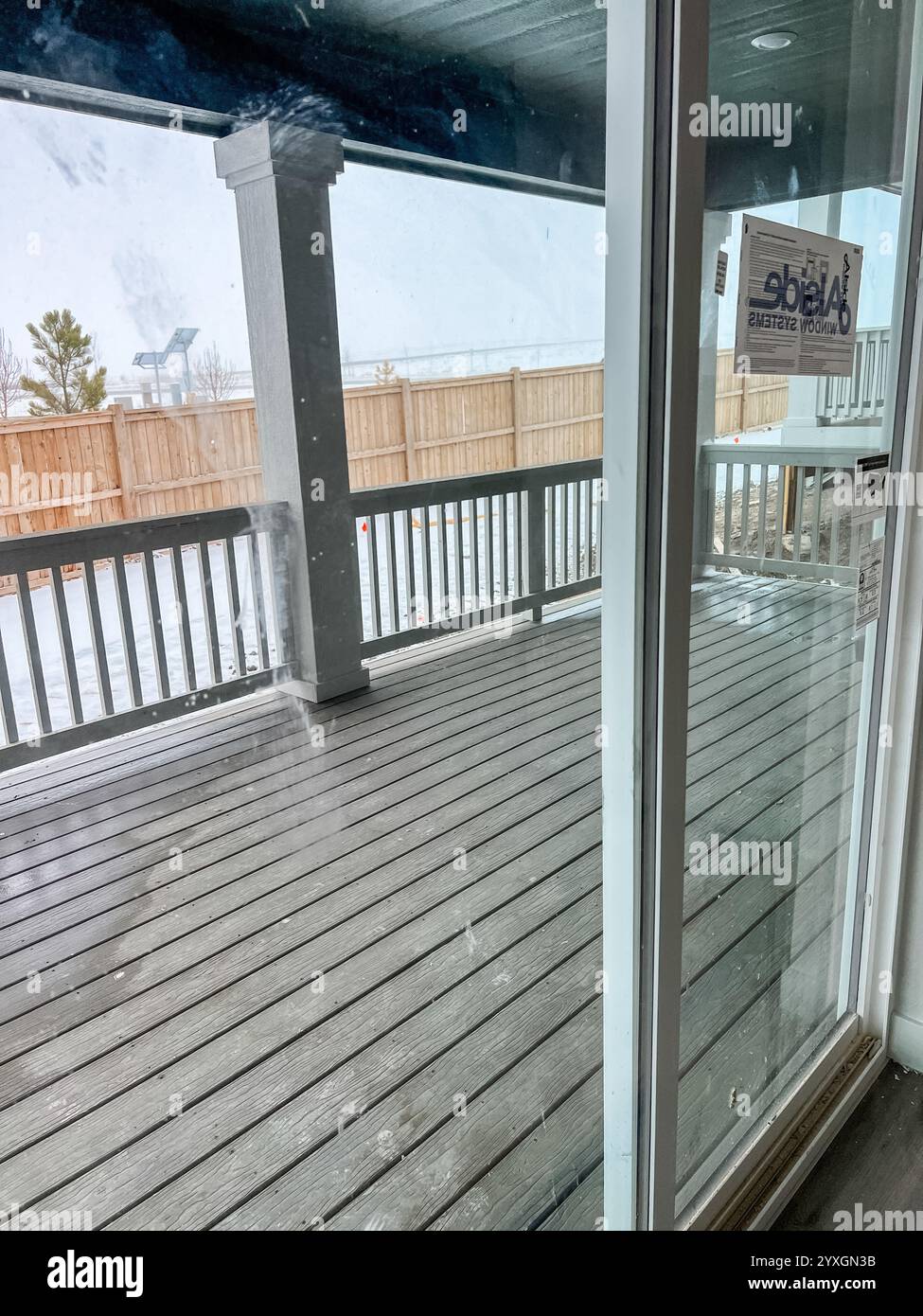 New Covered Backyard Deck with Wood Fencing Stock Photo - Alamy