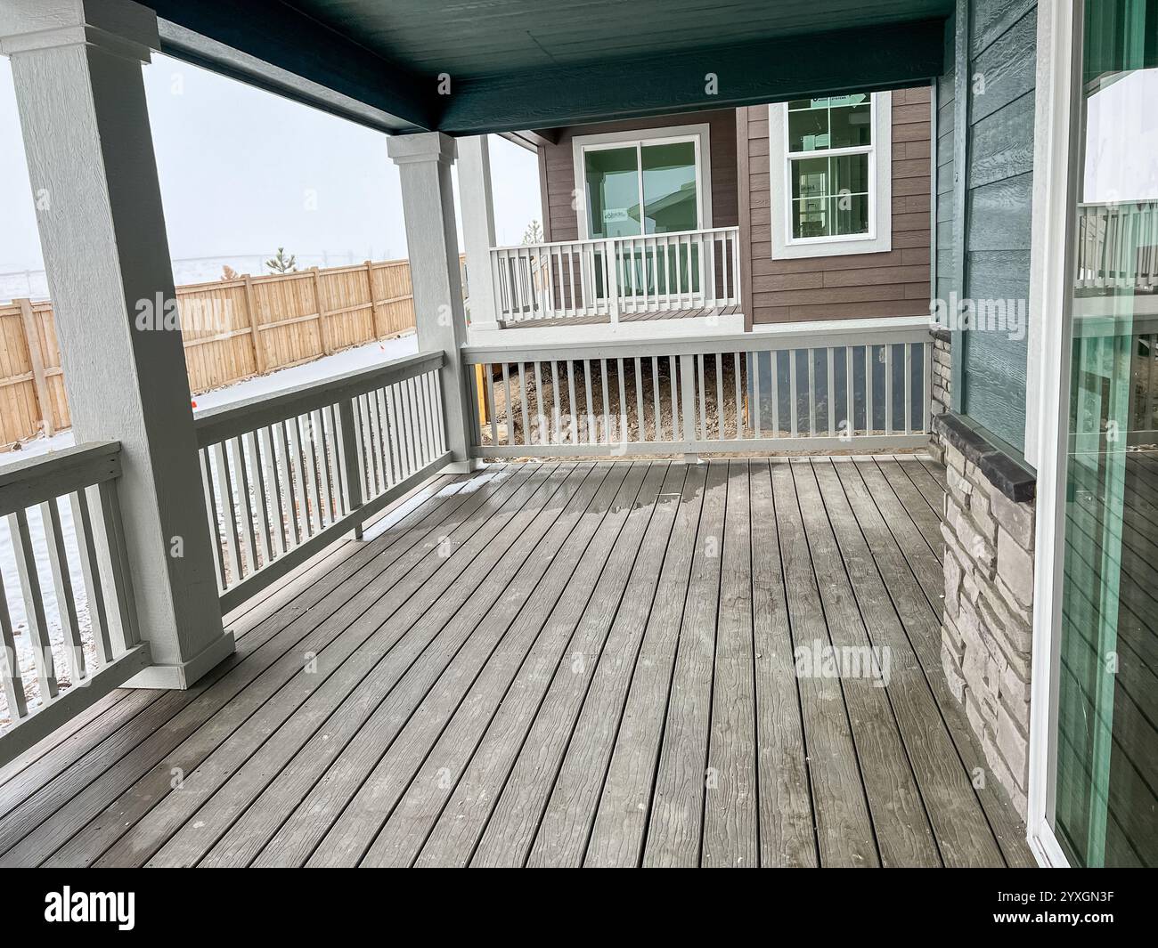New Covered Backyard Deck with Wood Fencing Stock Photo - Alamy