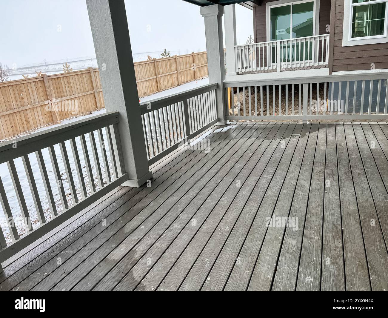 New Covered Backyard Deck with Wood Fencing Stock Photo - Alamy