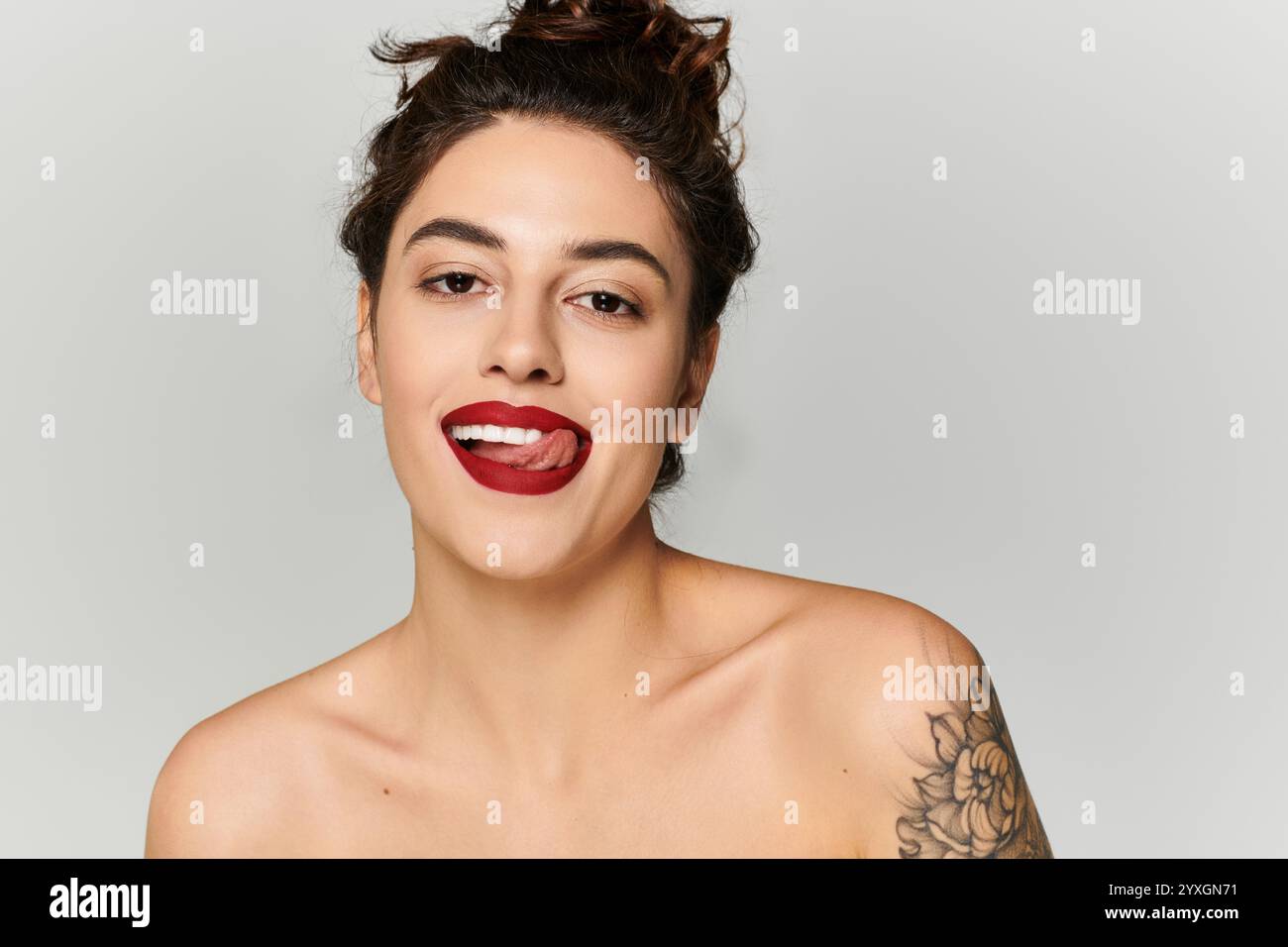 Woman smiles playfully, showcasing her confident personality and bold ...