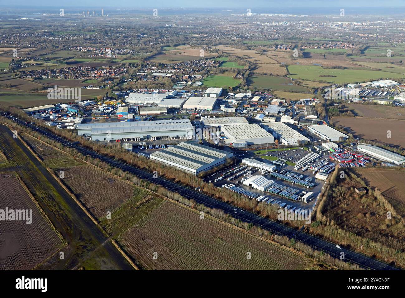 aerial view across the M56 motorway towards Appleton Thorn Trading ...