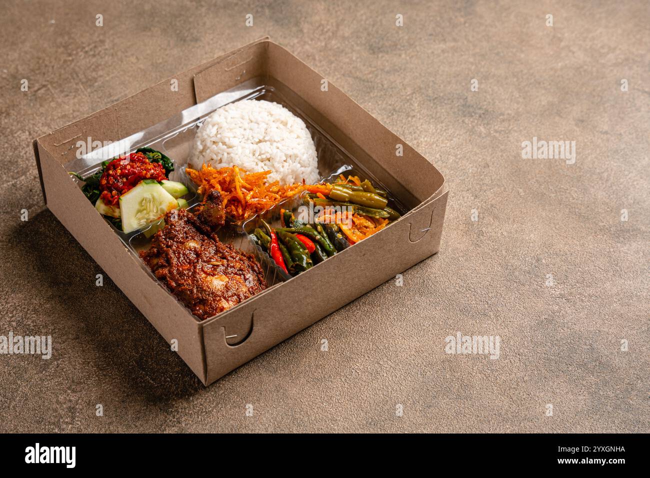 In Indonesian it is called Rice Box or Nasi kotak with ayam rendang ...
