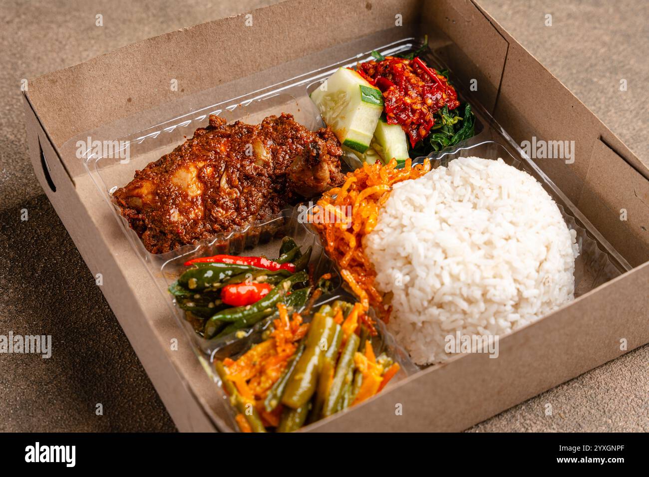 In Indonesian it is called Rice Box or Nasi kotak with ayam rendang ...