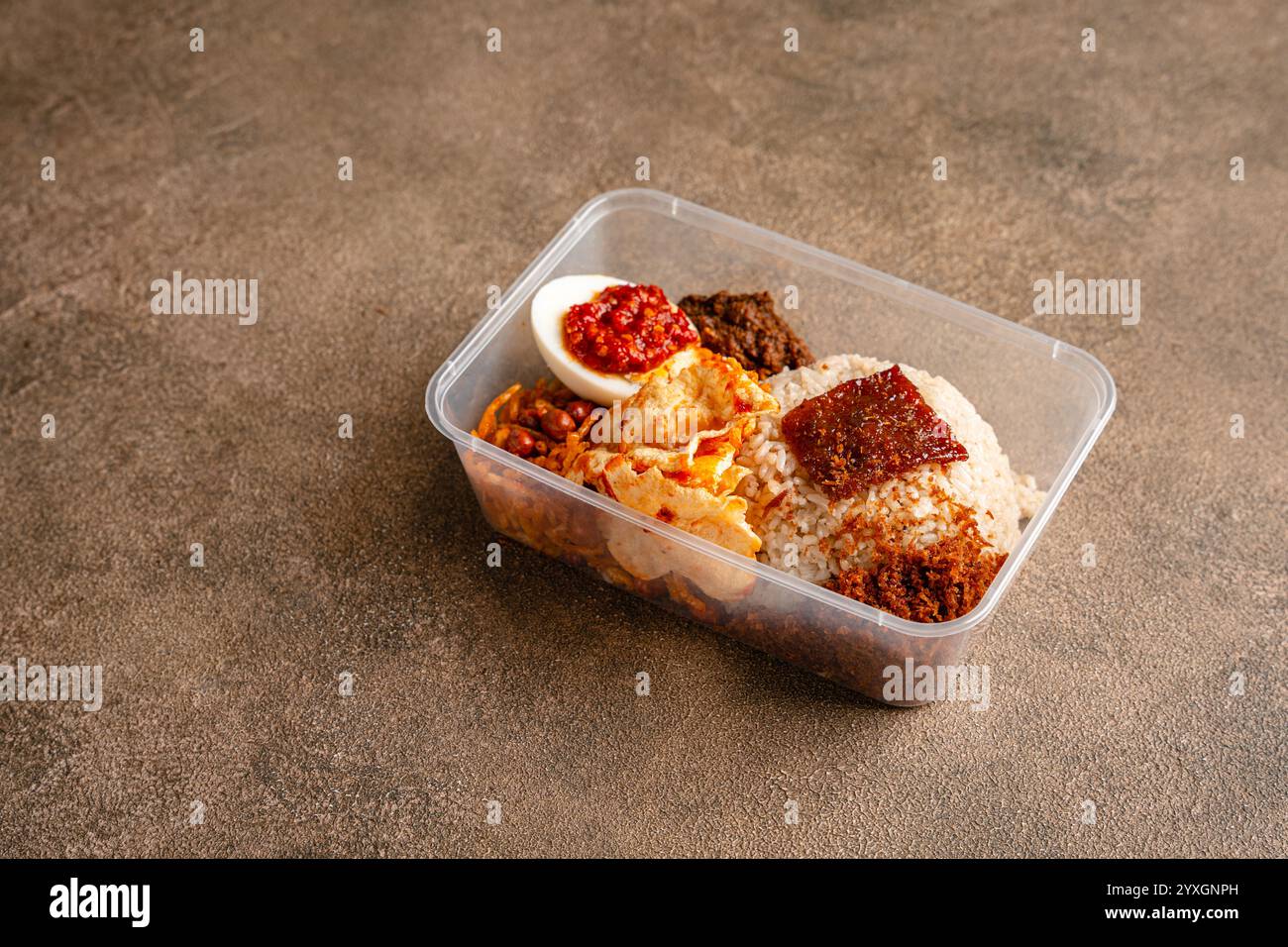 In Indonesian it is called Rice Box or Nasi kotak contains pork rendang ...