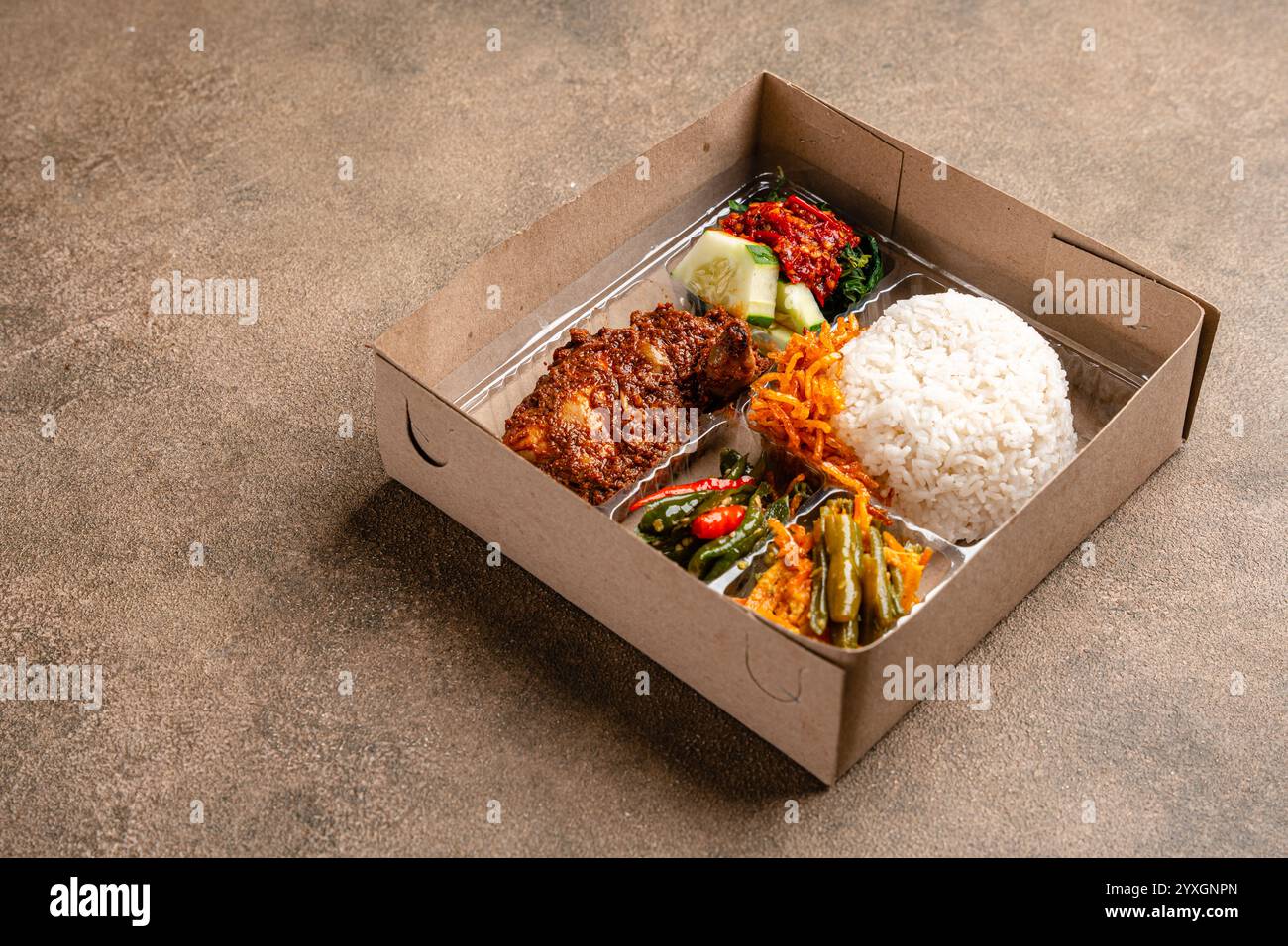 In Indonesian it is called Rice Box or Nasi kotak with ayam rendang ...