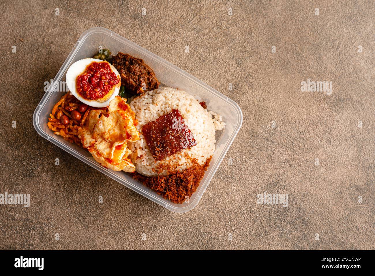 In Indonesian it is called Rice Box or Nasi kotak contains pork rendang ...