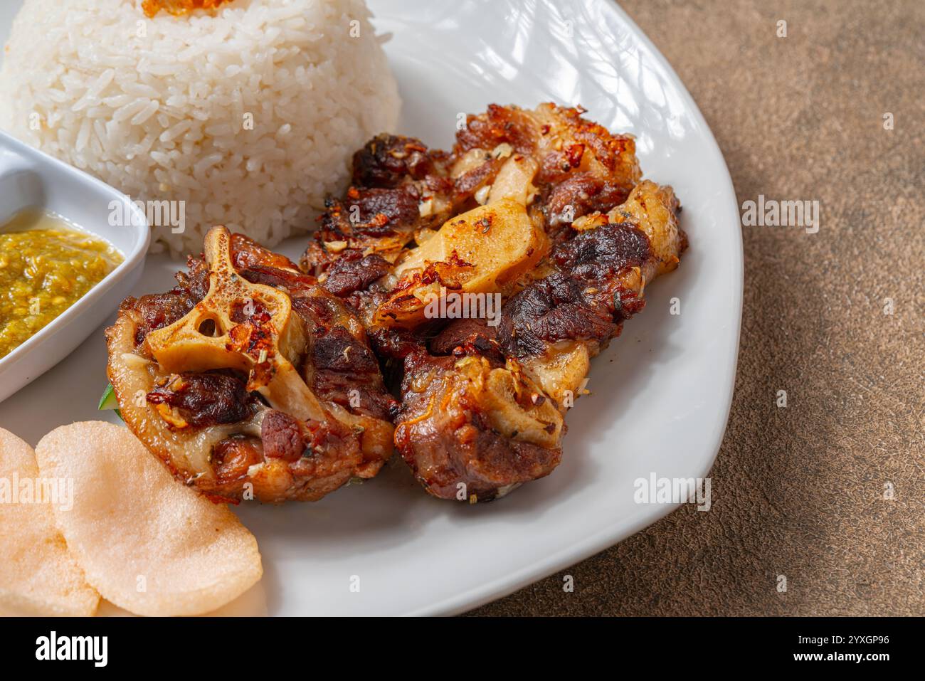 Grilled beef ribs with bbq sauce and rice Stock Photo - Alamy